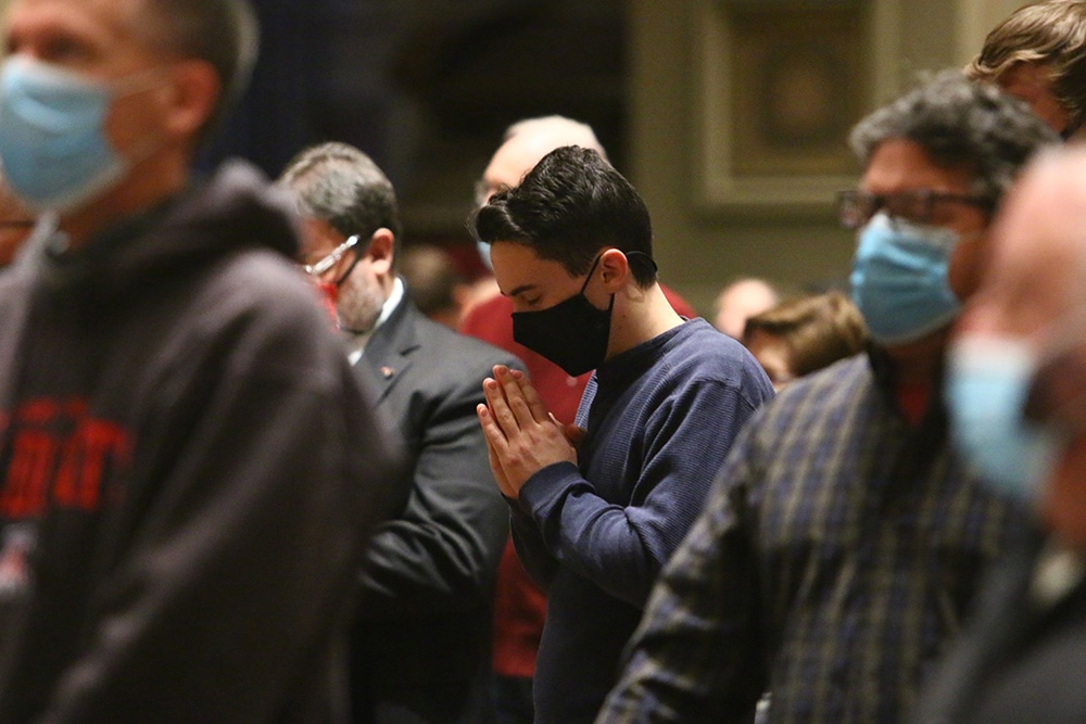 Face masks make a comeback among worshippers as coronavirus variant surges