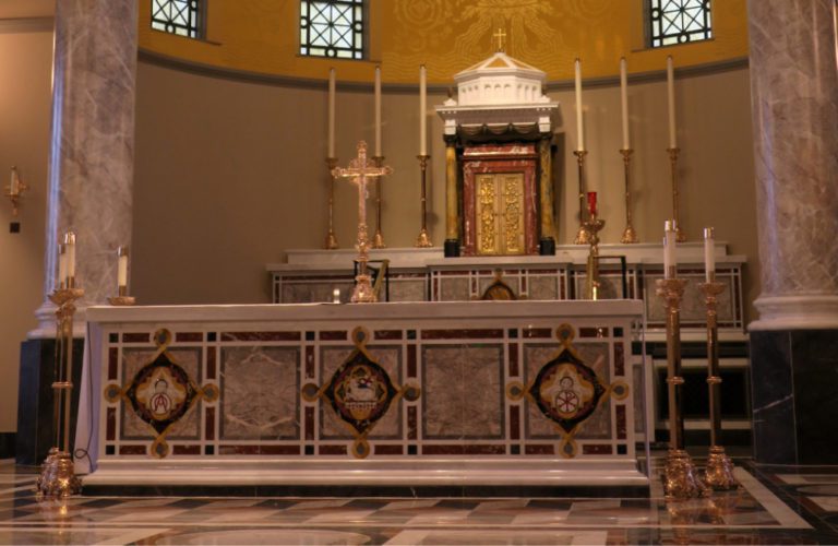 Do I bow or genuflect when entering the sanctuary?