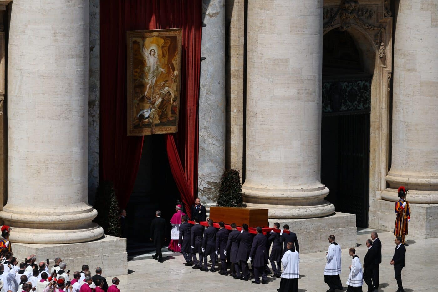 Poor and powerful pray for eternal repose of a pope at funeral